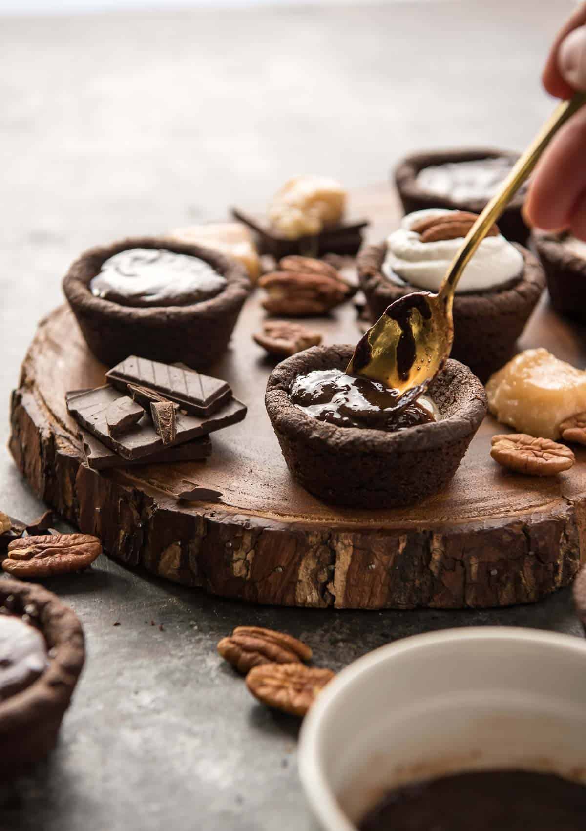 Gooey Triple-Layer Chocolate Turtle Pie Cookie Cups • The Crumby Kitchen