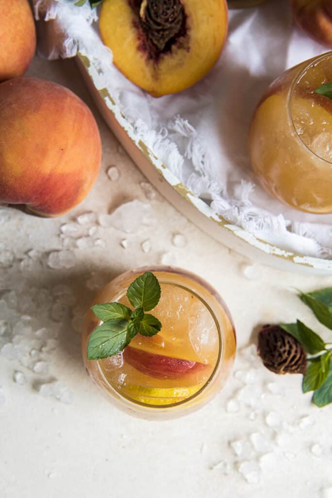 Easy White Peach Sangria • The Crumby Kitchen